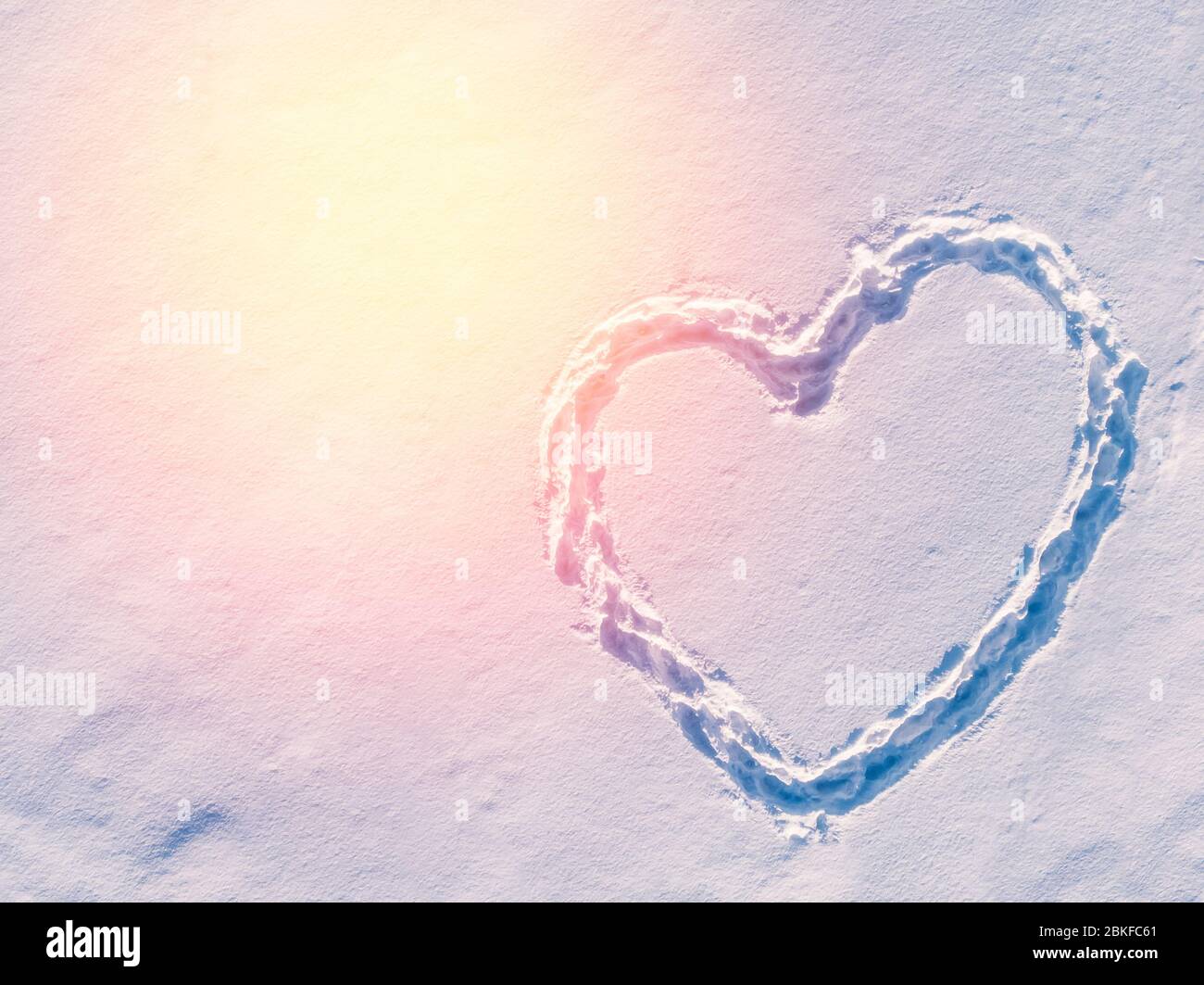 Heart symbol made of footprints in the snow, top view. Aerial photo ...