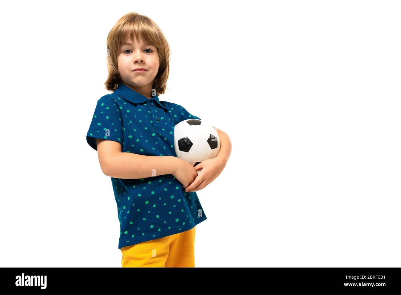 sport boy holds a soccer ball in his hands on a white background Stock ...