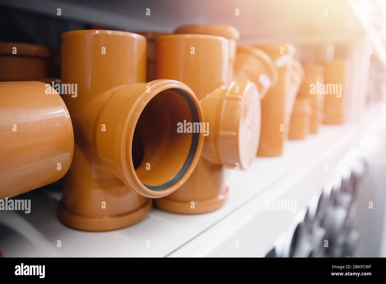 PVC plastic construction pipes for water are displayed in row on ...