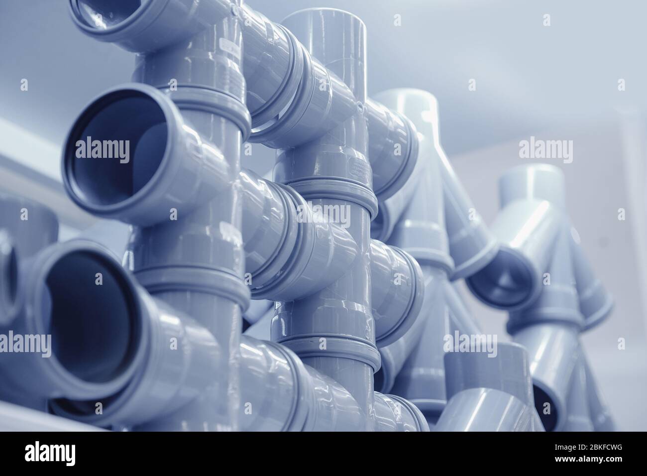PVC plastic construction pipes for water are displayed in row on ...