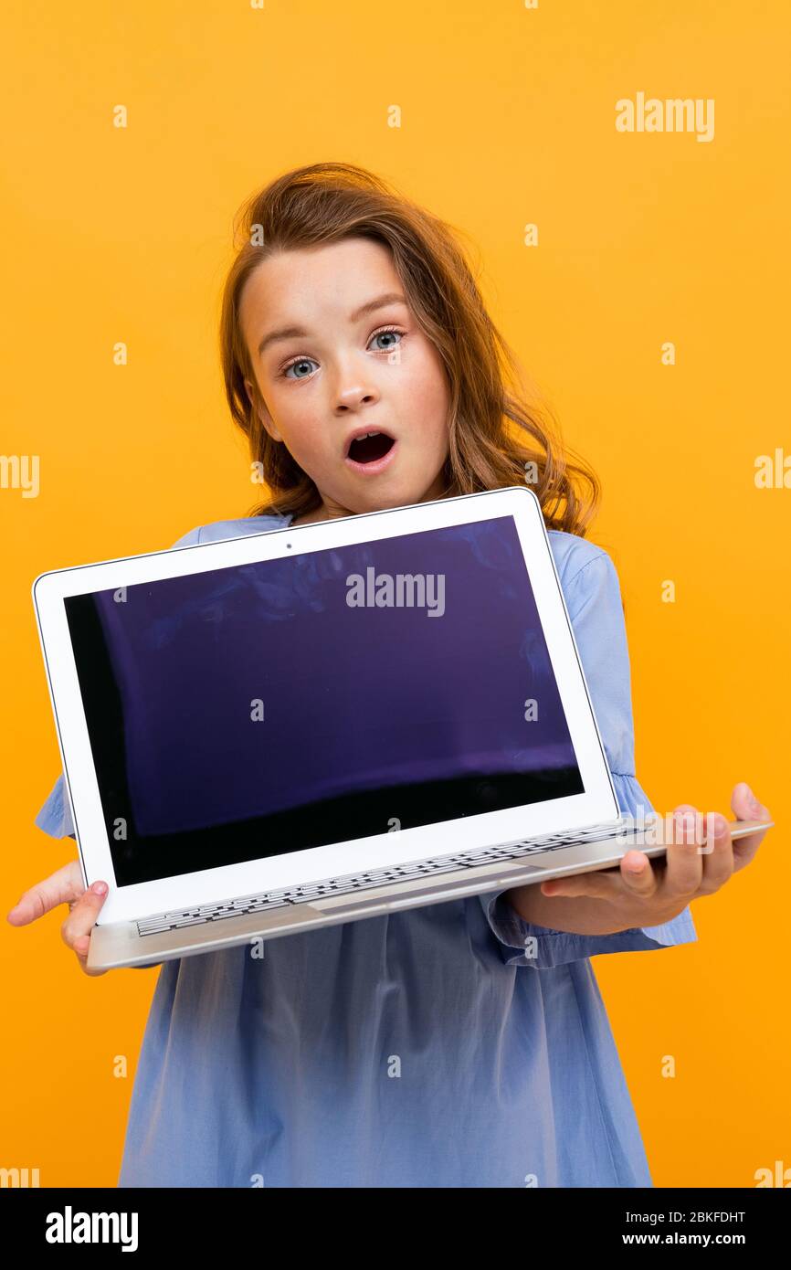 Child holding picture up to computer hi-res stock photography and ...