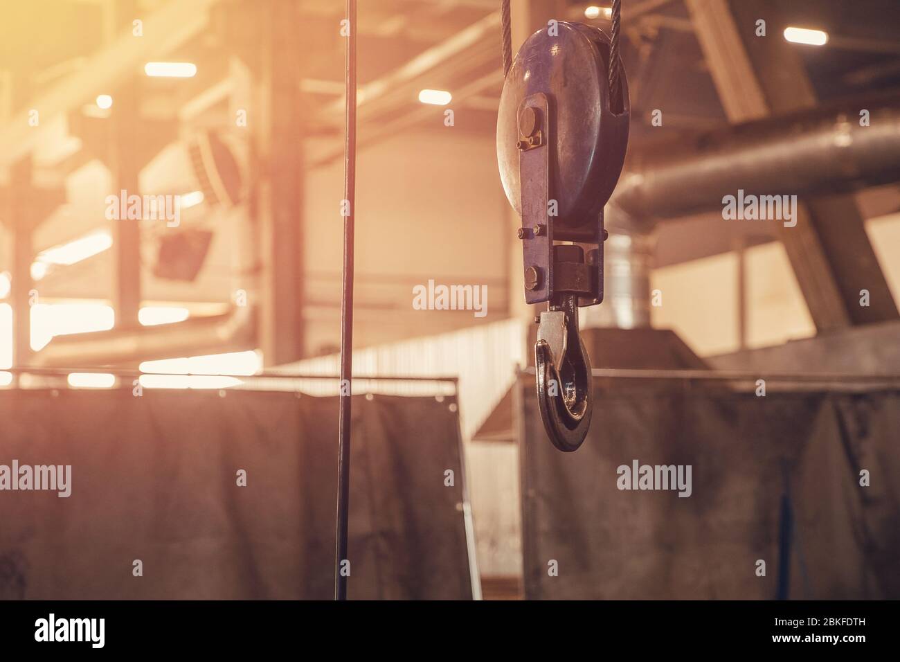 Crane chain and hook with blurred warehouse background. Concept ...