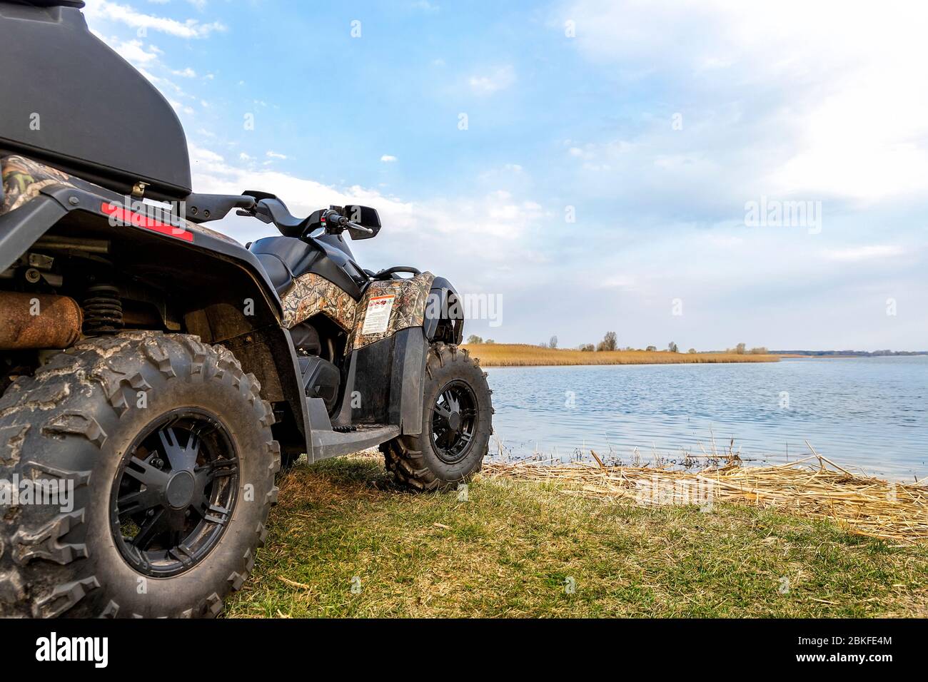 ATV awd quadbike motorcycle pov view near lake or river pond coast with ...