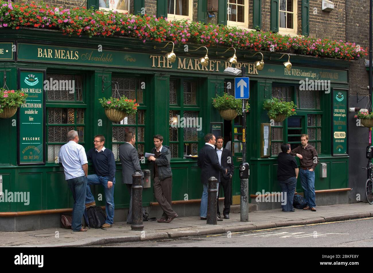 People standing outside a London pub, the Market Porter,London, England ...