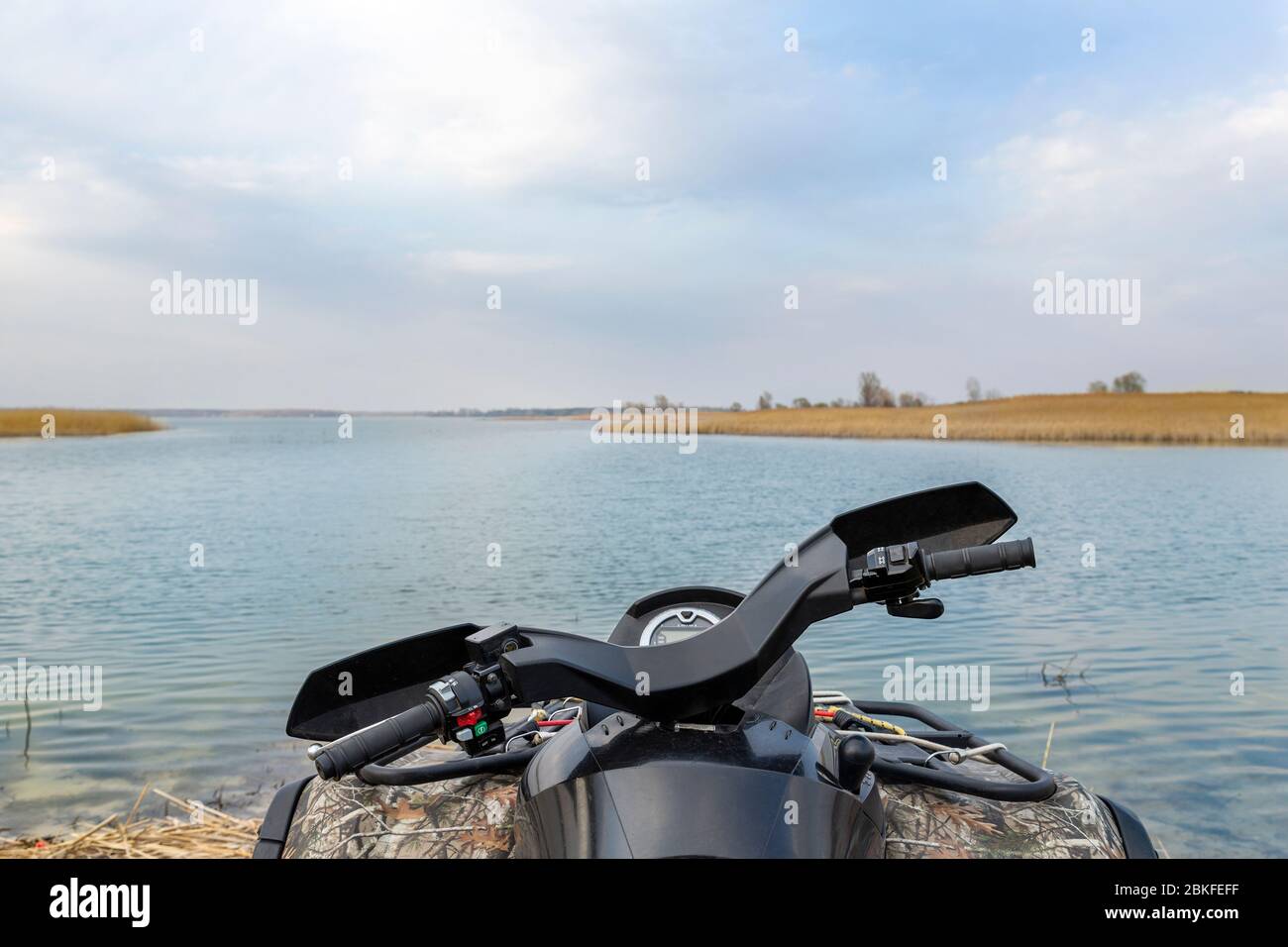 ATV awd quadbike motorcycle pov view near lake or river pond coast with ...