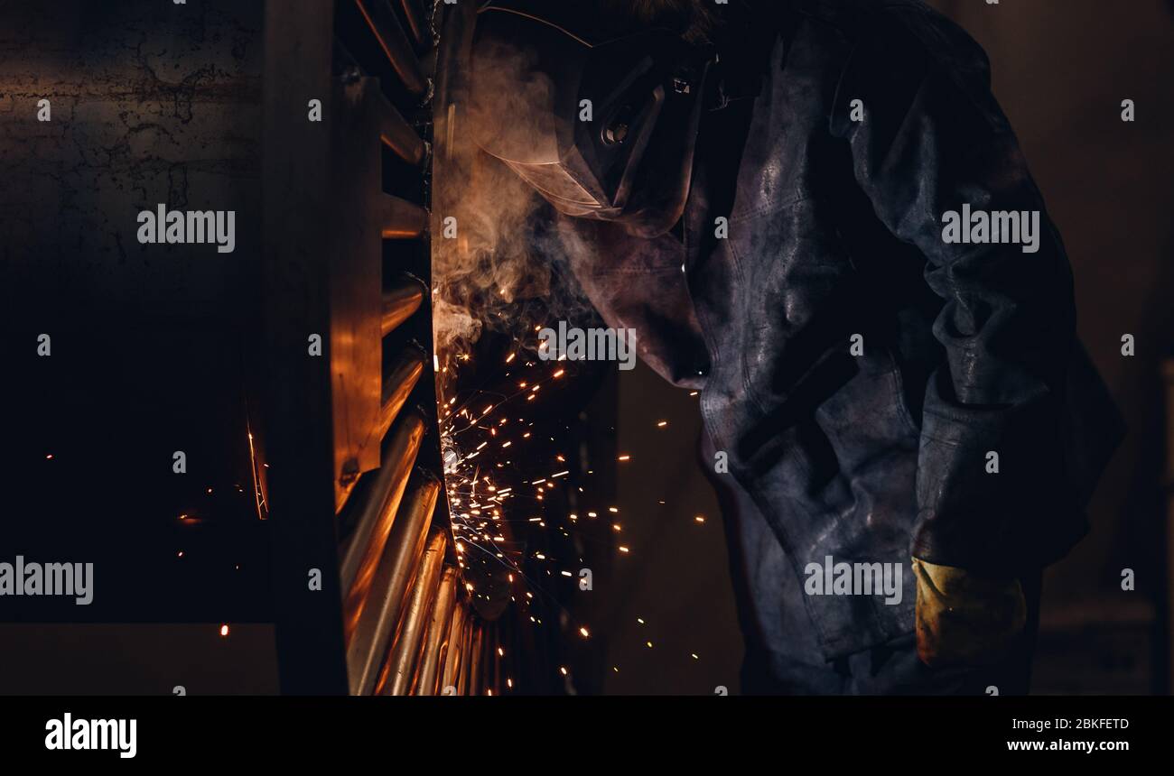 Professional welder performs welding hi-res stock photography and ...