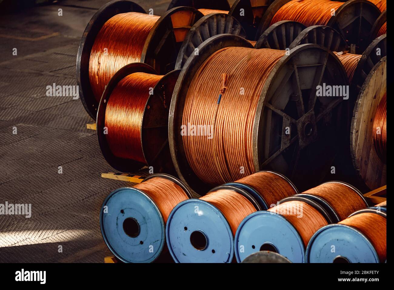 Production of copper wire, bronze cable in reels at factory Stock Photo ...