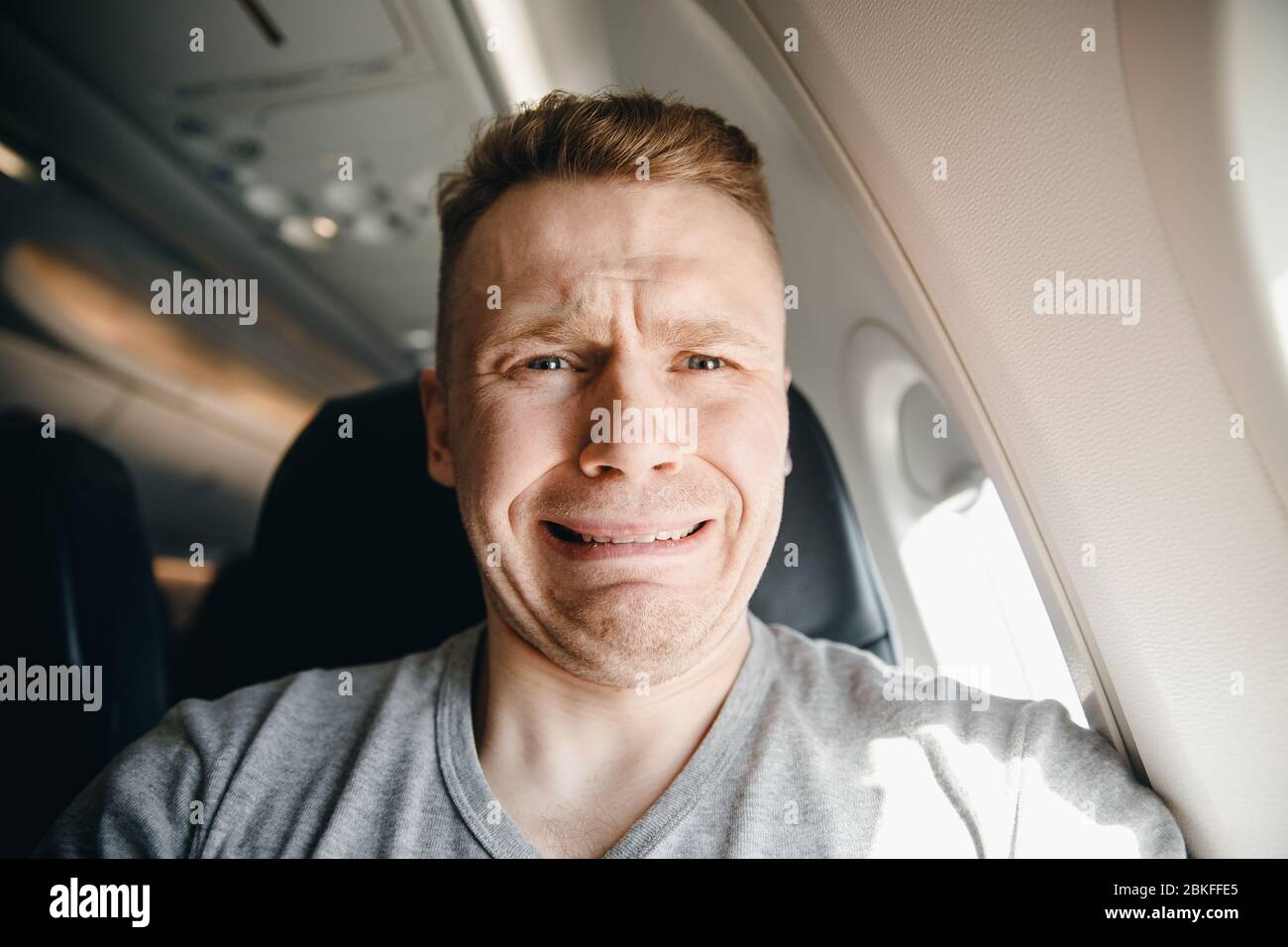 Concept aerophobia. Afraid of fear flying on an airplane and at height ...