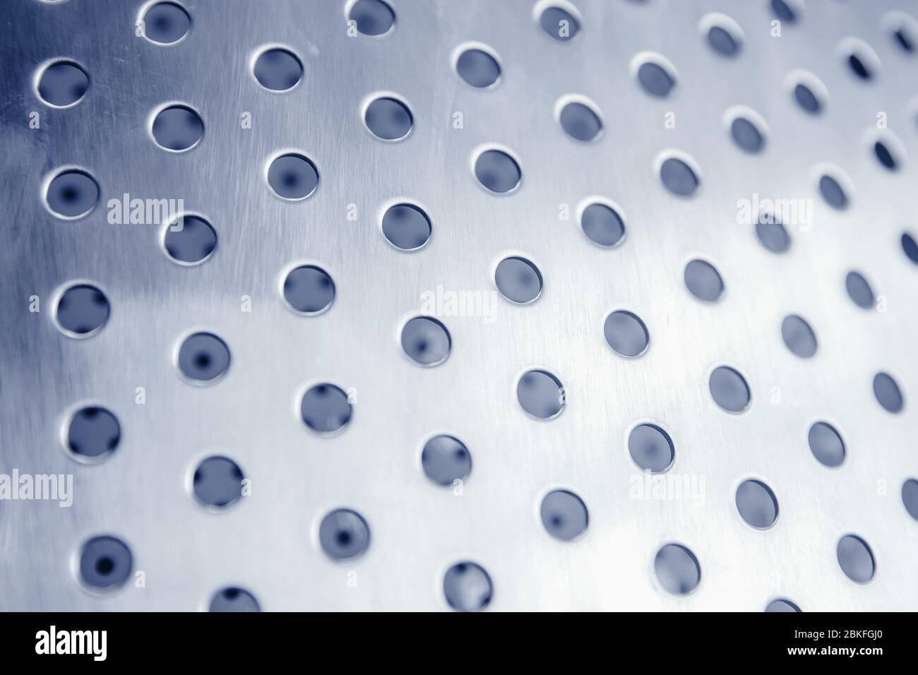 Industrial iron background in blue with professional holes and ...
