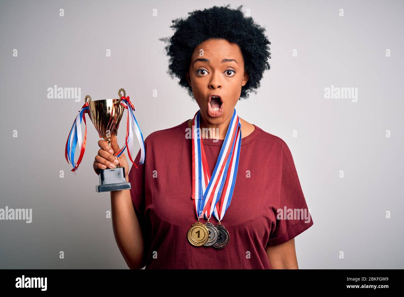 Young African American afro athlete woman with curly hair wearing ...