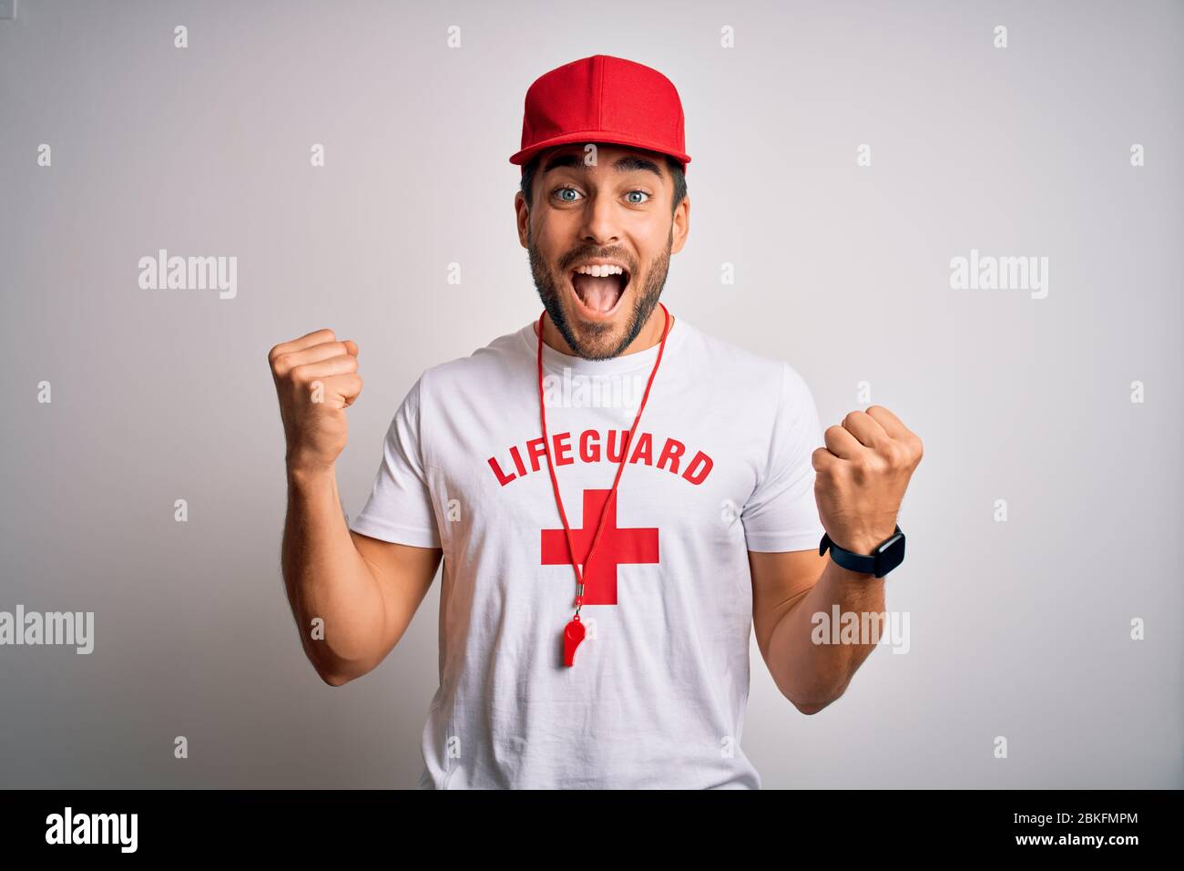 Young handsome lifeguard man with beard wearing t-shirt with red cross ...