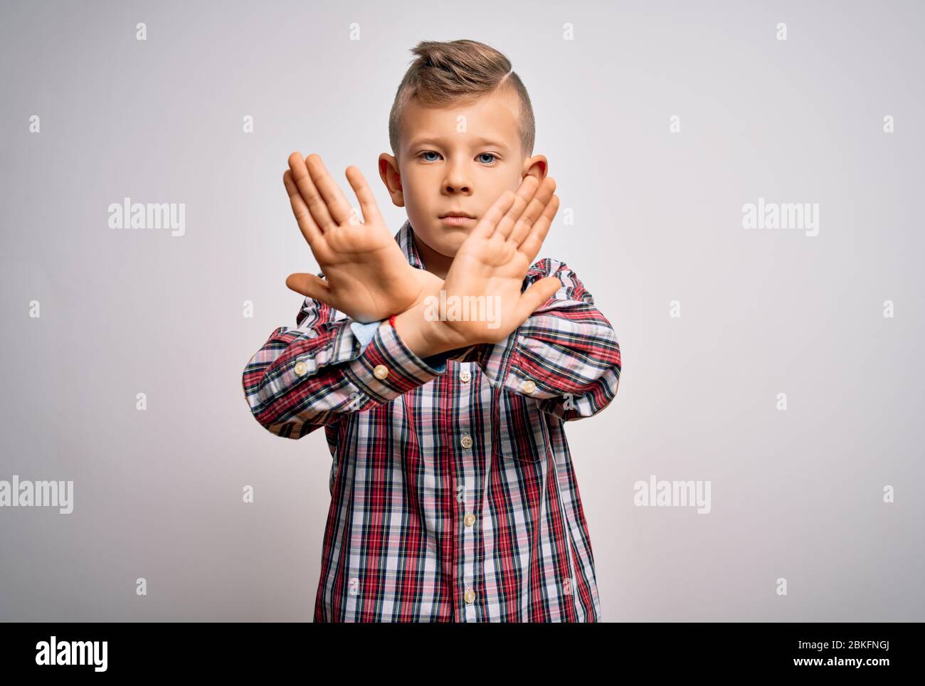 Young little caucasian kid with blue eyes wearing elegant shirt ...
