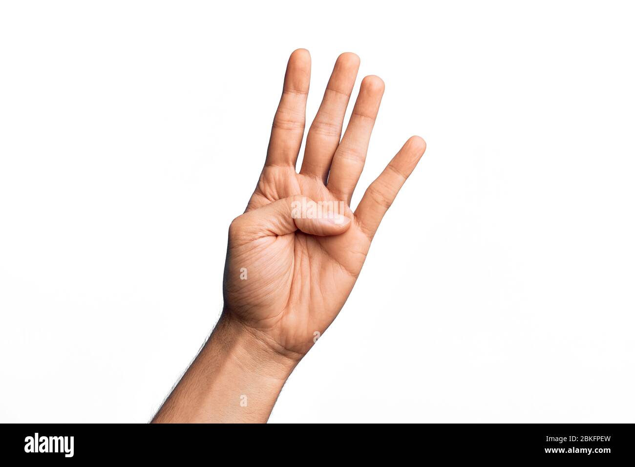 Hand of caucasian young man showing fingers over isolated white background counting number 4 ...