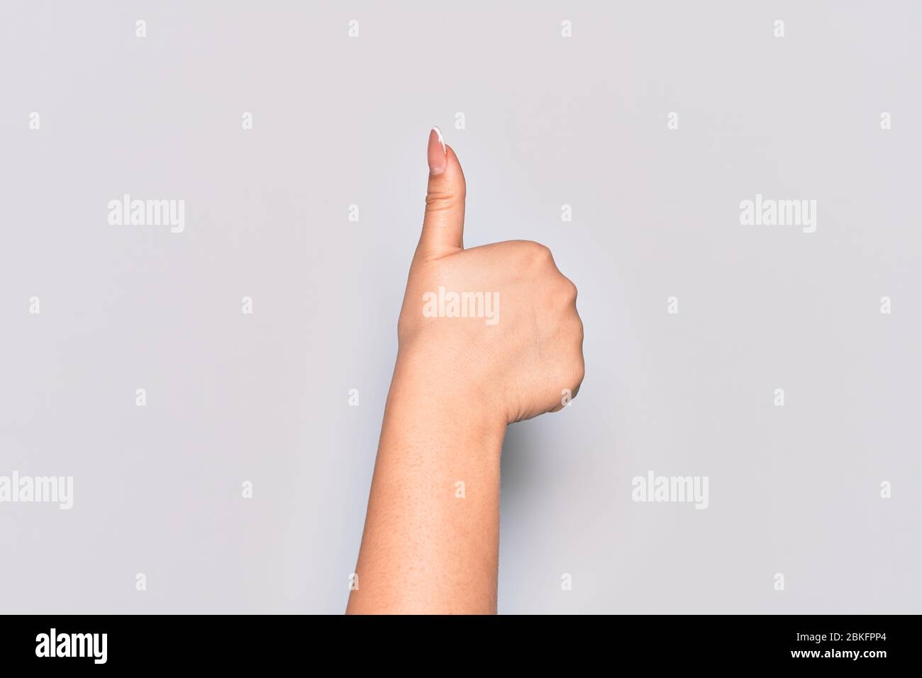 Hand of caucasian young woman doing successful approval gesture with ...