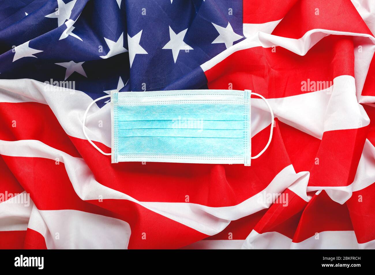 Covid-19 Coronavirus in USA. Protective surgical face mask on American ...