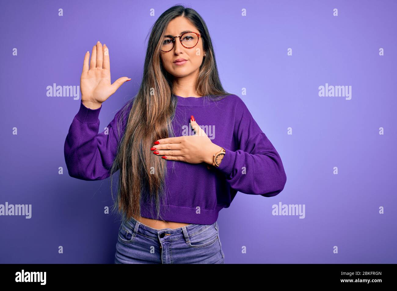 Young beautiful smart woman wearing glasses over purple isolated ...