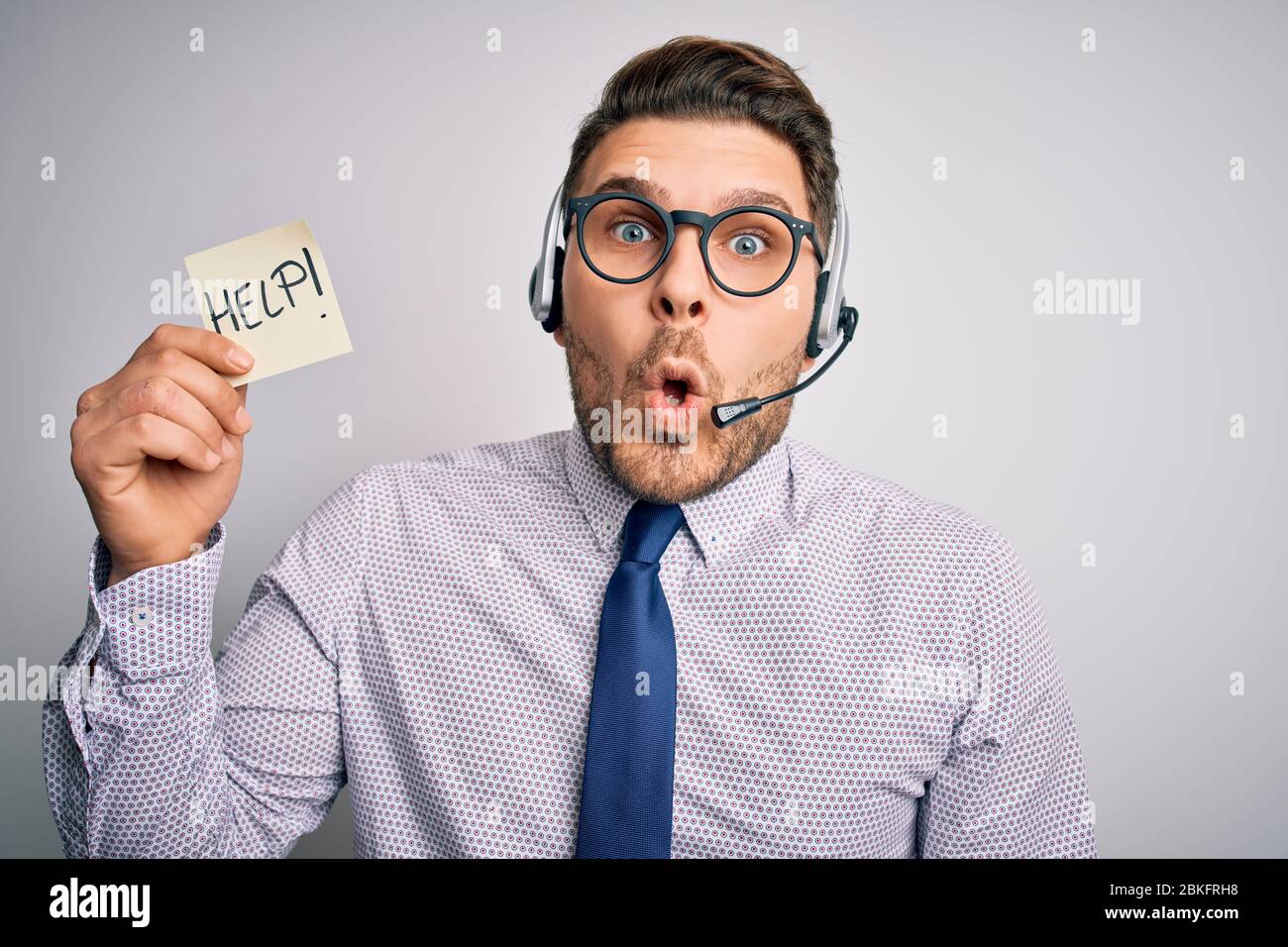 Young call center operator business man with blue eyes offering support ...