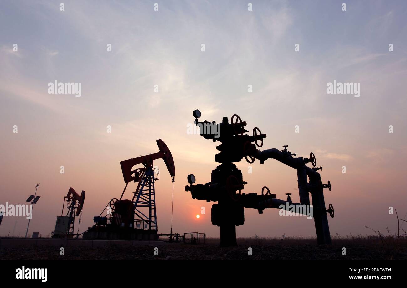 Oil field scene, oil pipelines and facilities Stock Photo - Alamy