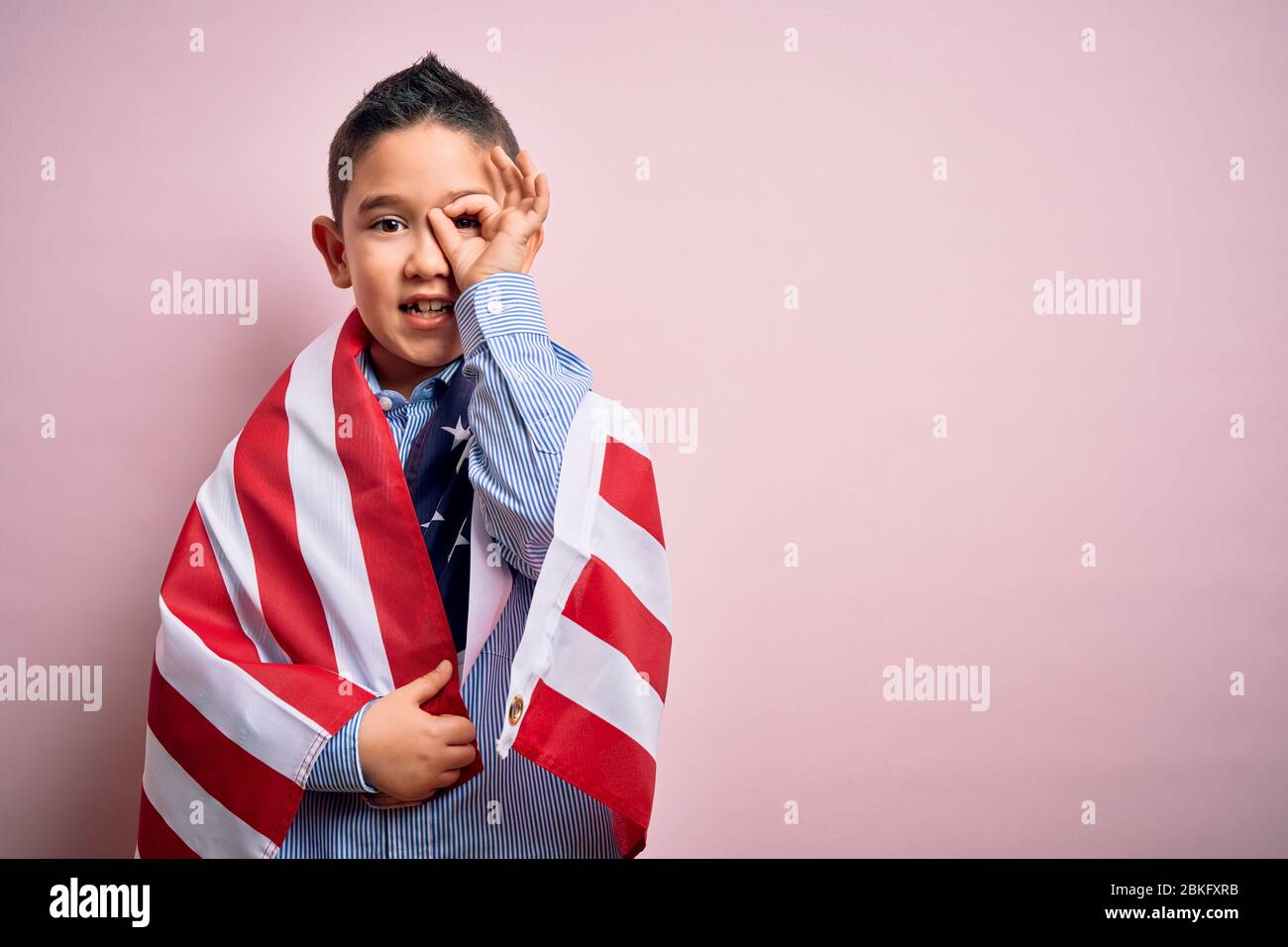 Young little patriotic boy kid covered on united states of america flag ...