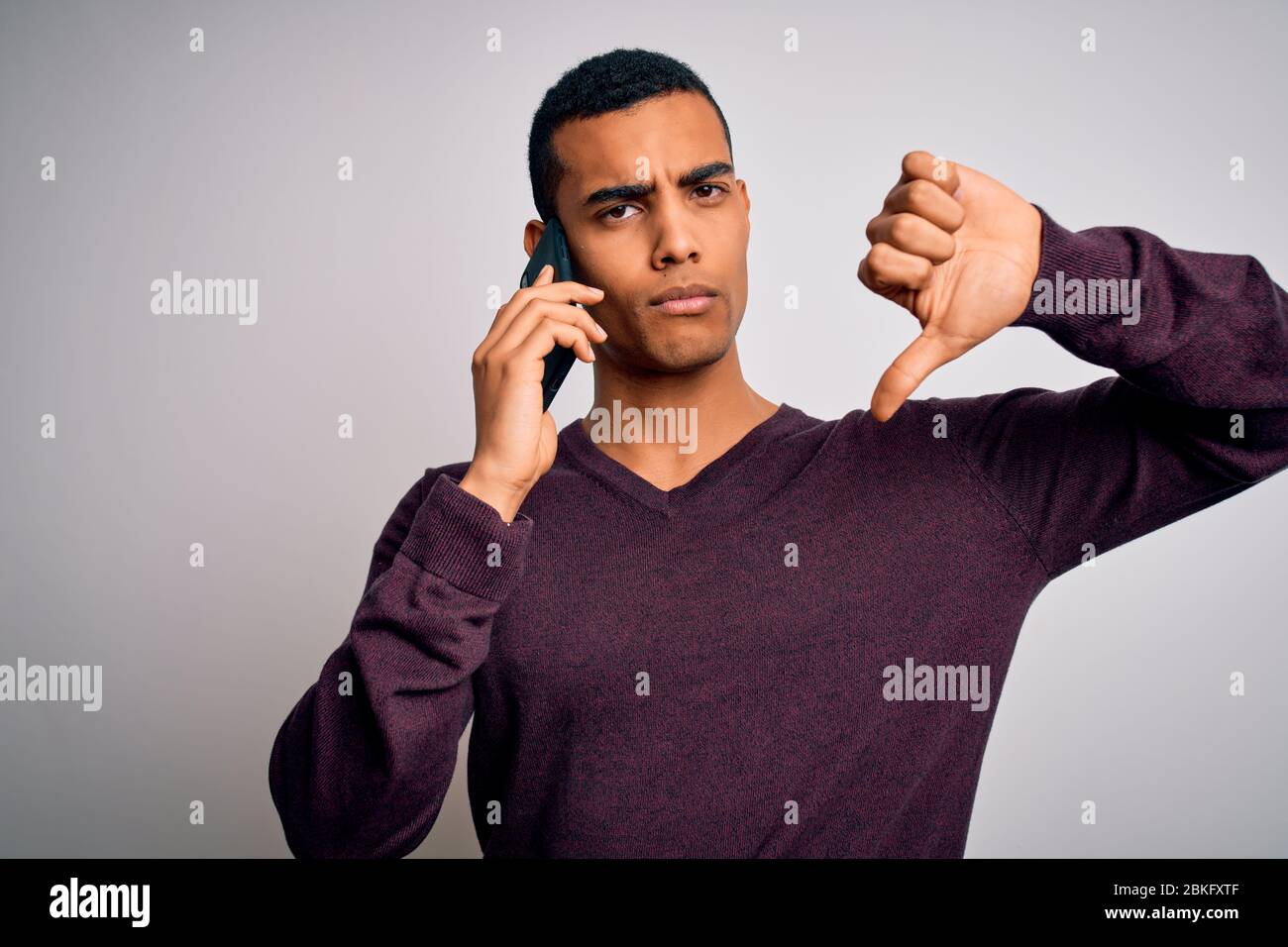 Young handsome african american man having conversation talking on the ...