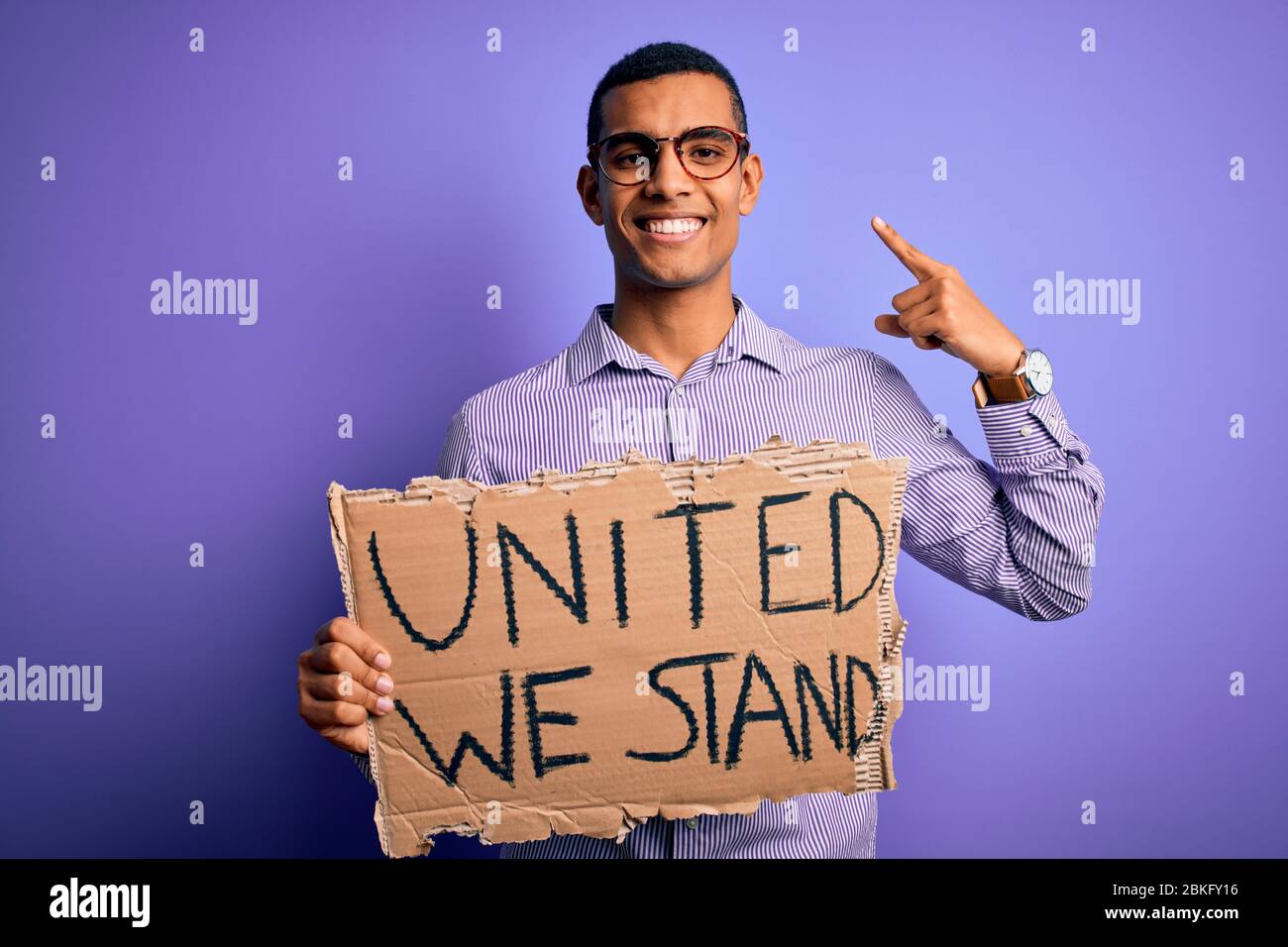 African american activist man asking for union holding banner with ...