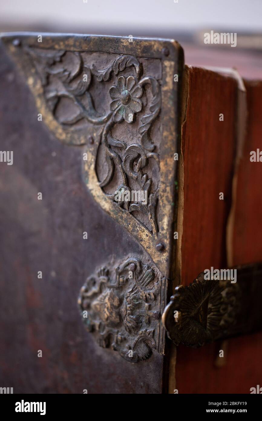 Large old leather book with metal corners and lock. Shallow depth of ...