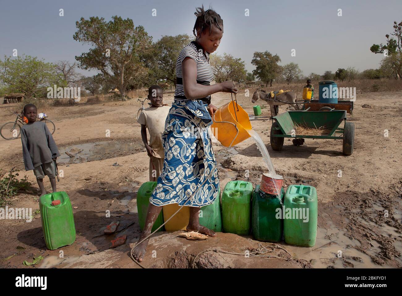 Collecting water, Burkina Faso, Africa Stock Photo - Alamy