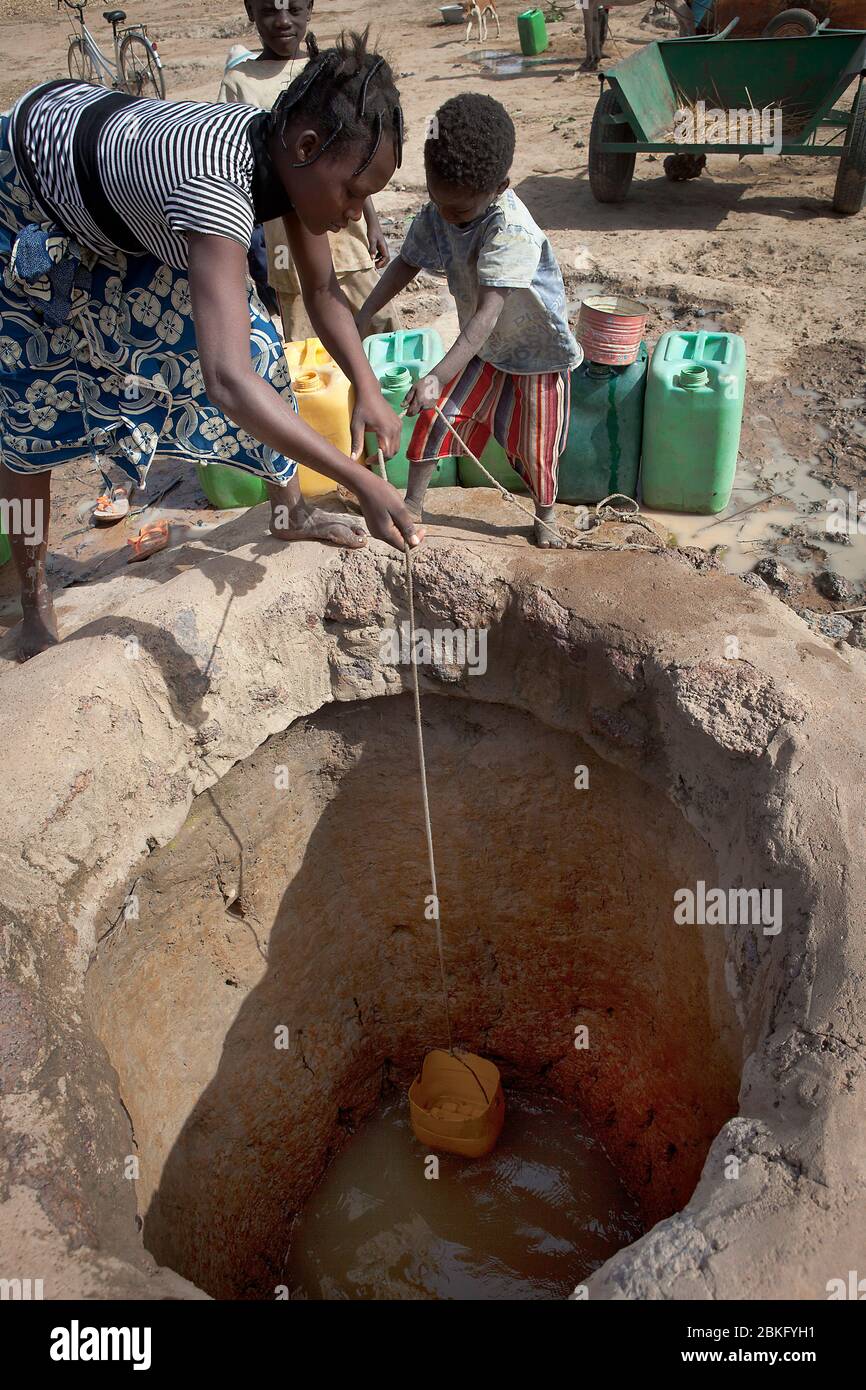 Collecting water, Burkina Faso, Africa Stock Photo - Alamy