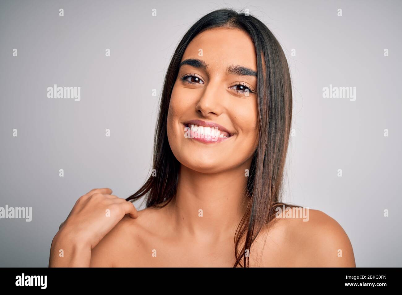 Close up of young beautiful woman with clear and pure skin. Perfect and ...