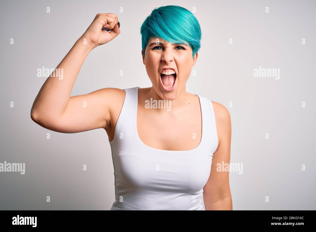 Young beautiful woman with blue fashion hair wearing casual t-shirt ...