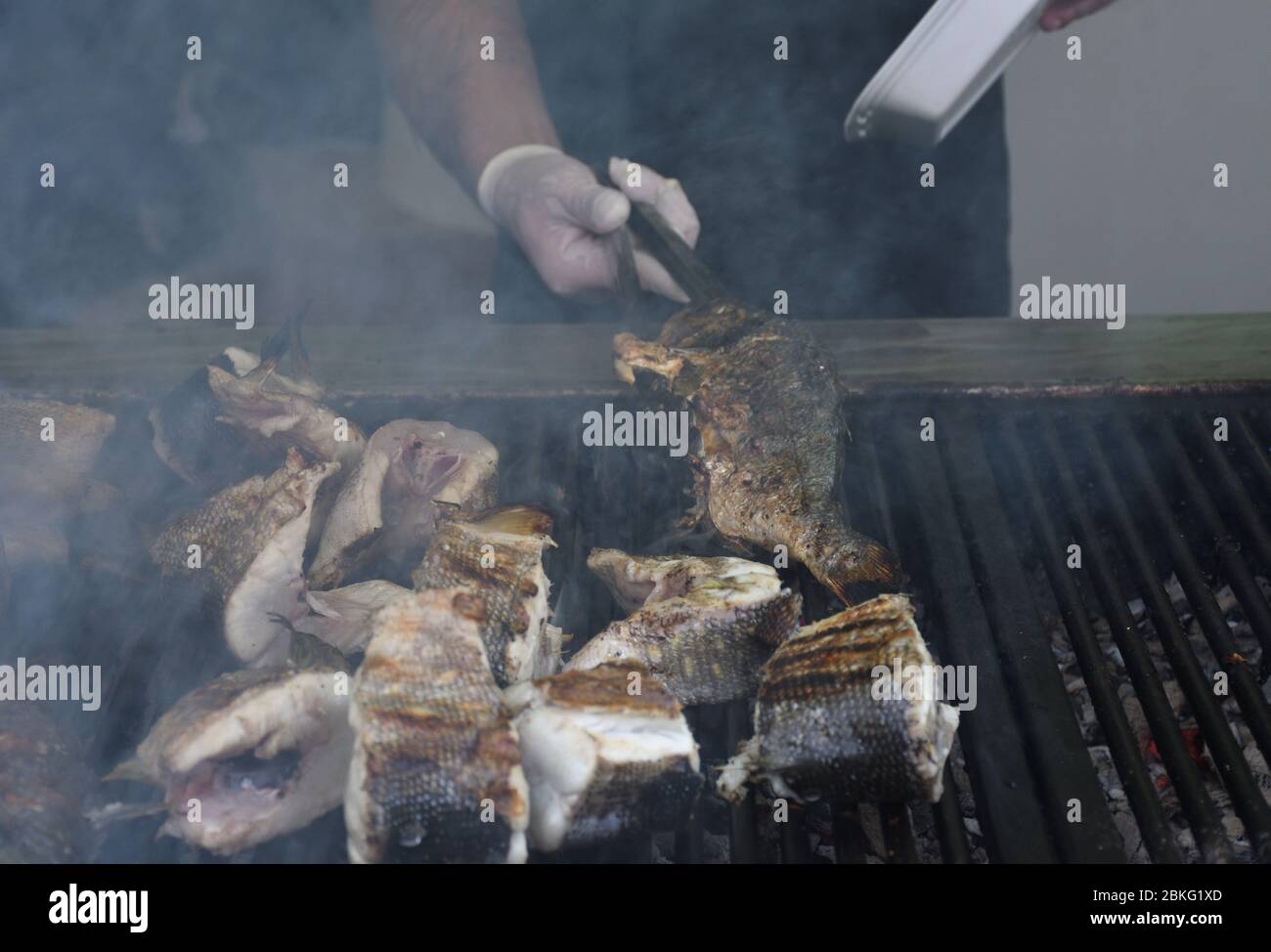 Freshly grilled fish on counter top stall, during seafood festival ...
