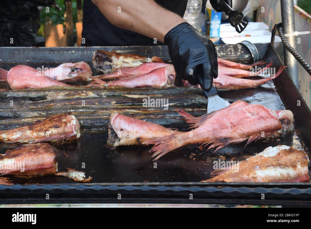 Fresh raw fish on grill slate, during seafood festival, street food ...