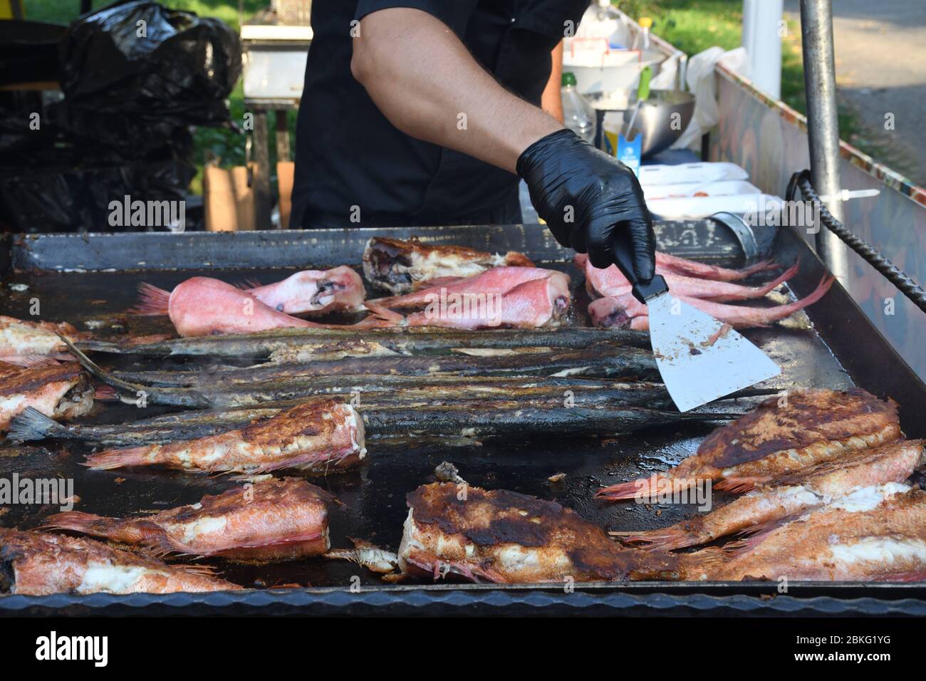 Fresh raw fish on grill slate, during seafood festival, street food ...