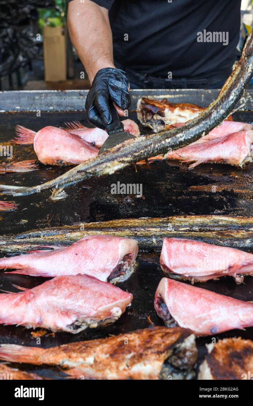Fresh raw fish on grill slate, during seafood festival, street food ...