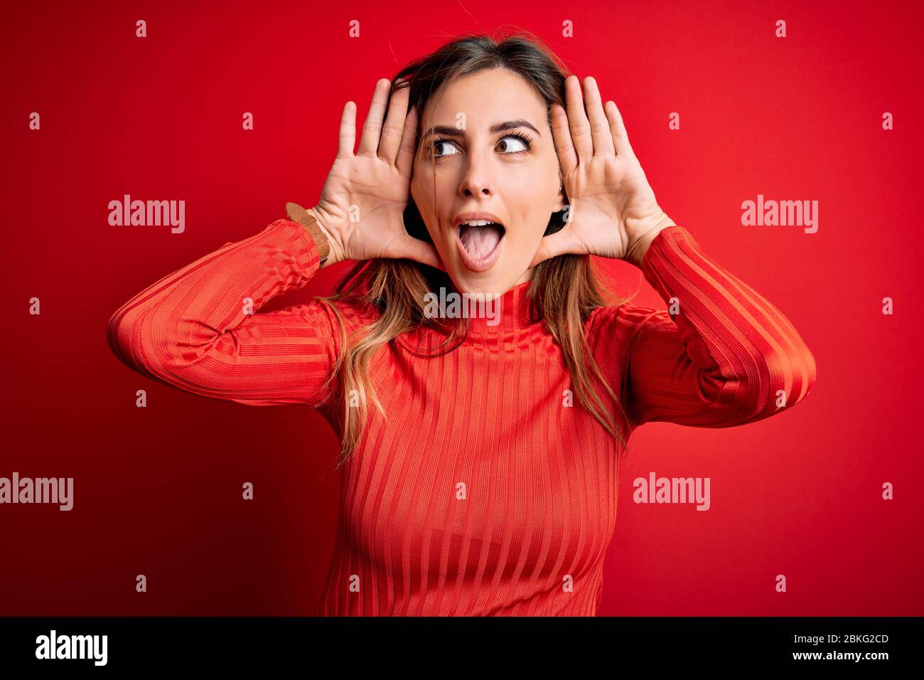 Young beautiful brunette woman wearing casual turtleneck sweater over ...