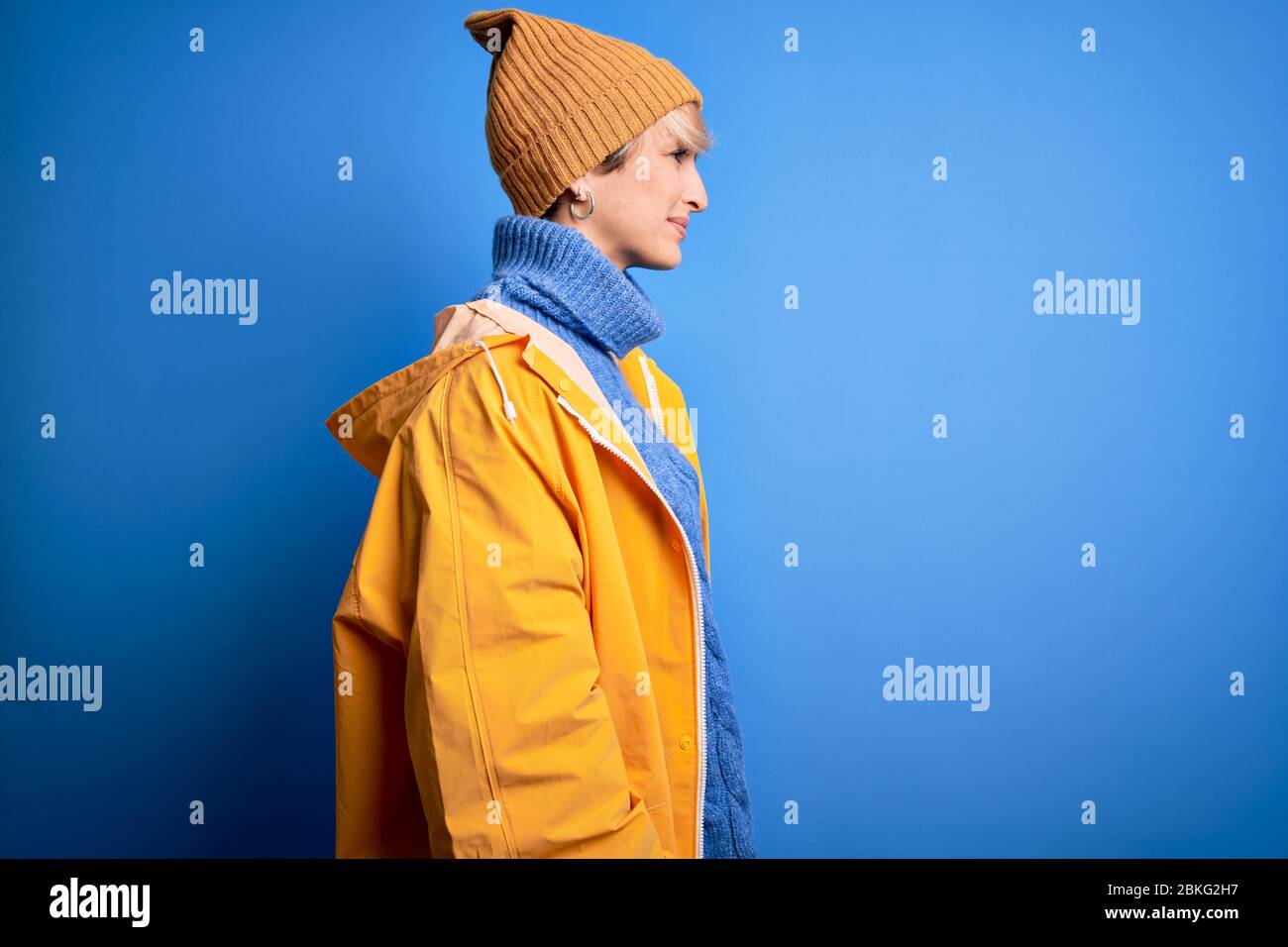 Side view woman wearing raincoat hi-res stock photography and images ...