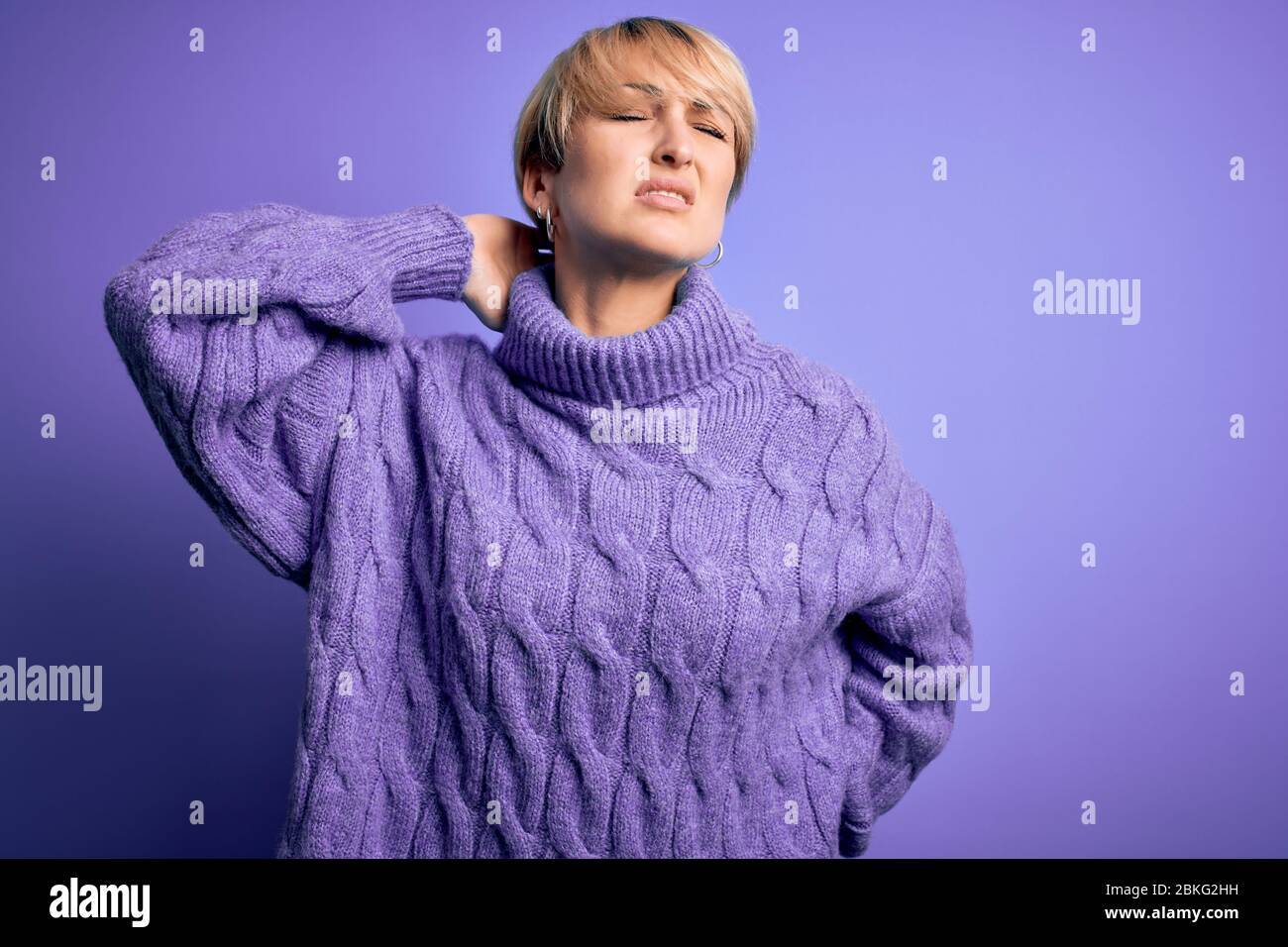 Young blonde woman with short hair wearing winter turtleneck sweater ...