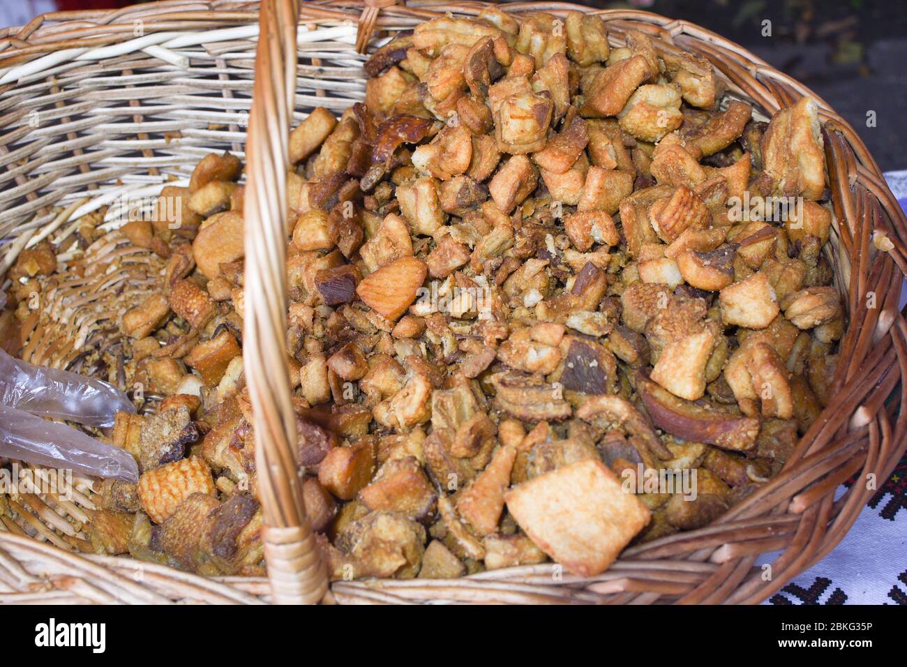 Jumari, delicious unhealthy fried pork greaves in a basket for sale ...