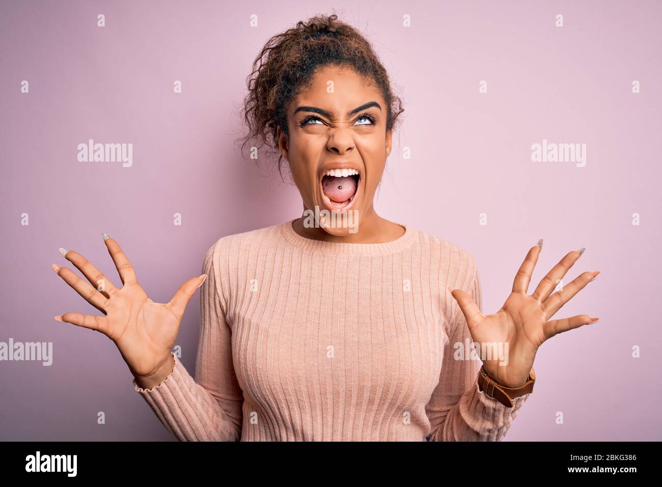 Young beautiful african american girl wearing casual sweater standing ...