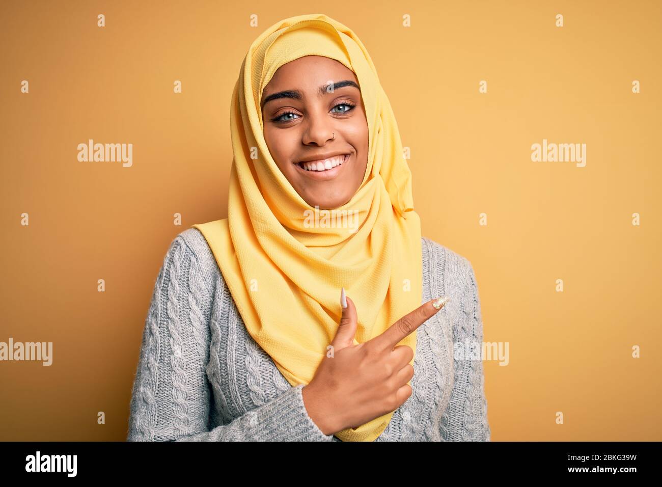 Young beautiful african american girl wearing muslim hijab over ...