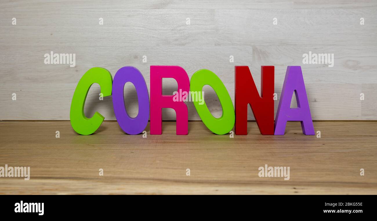 text corona in colors on wood banner Stock Photo - Alamy