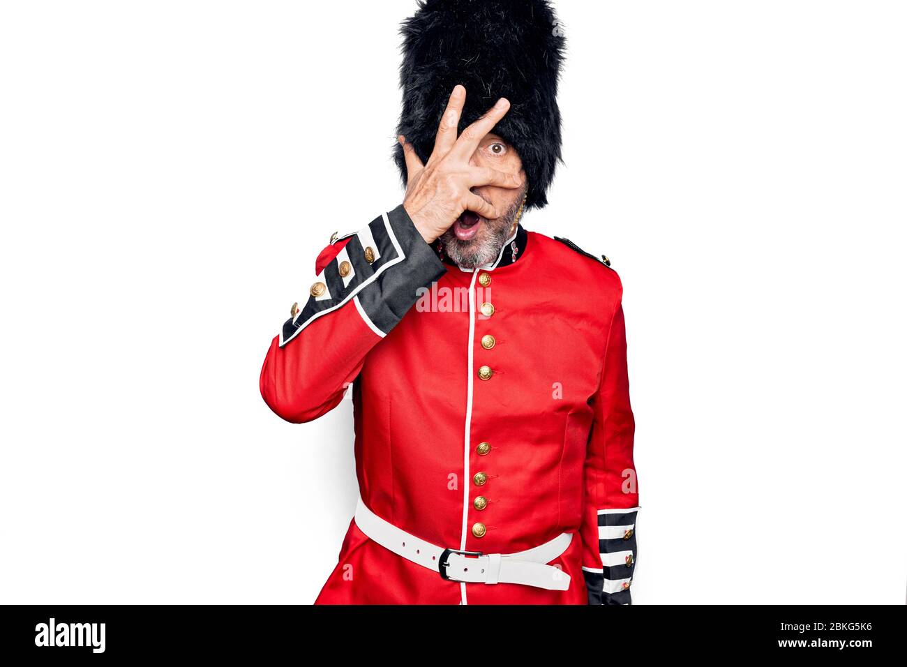 Middle age handsome wales guard man wearing traditional uniform over ...