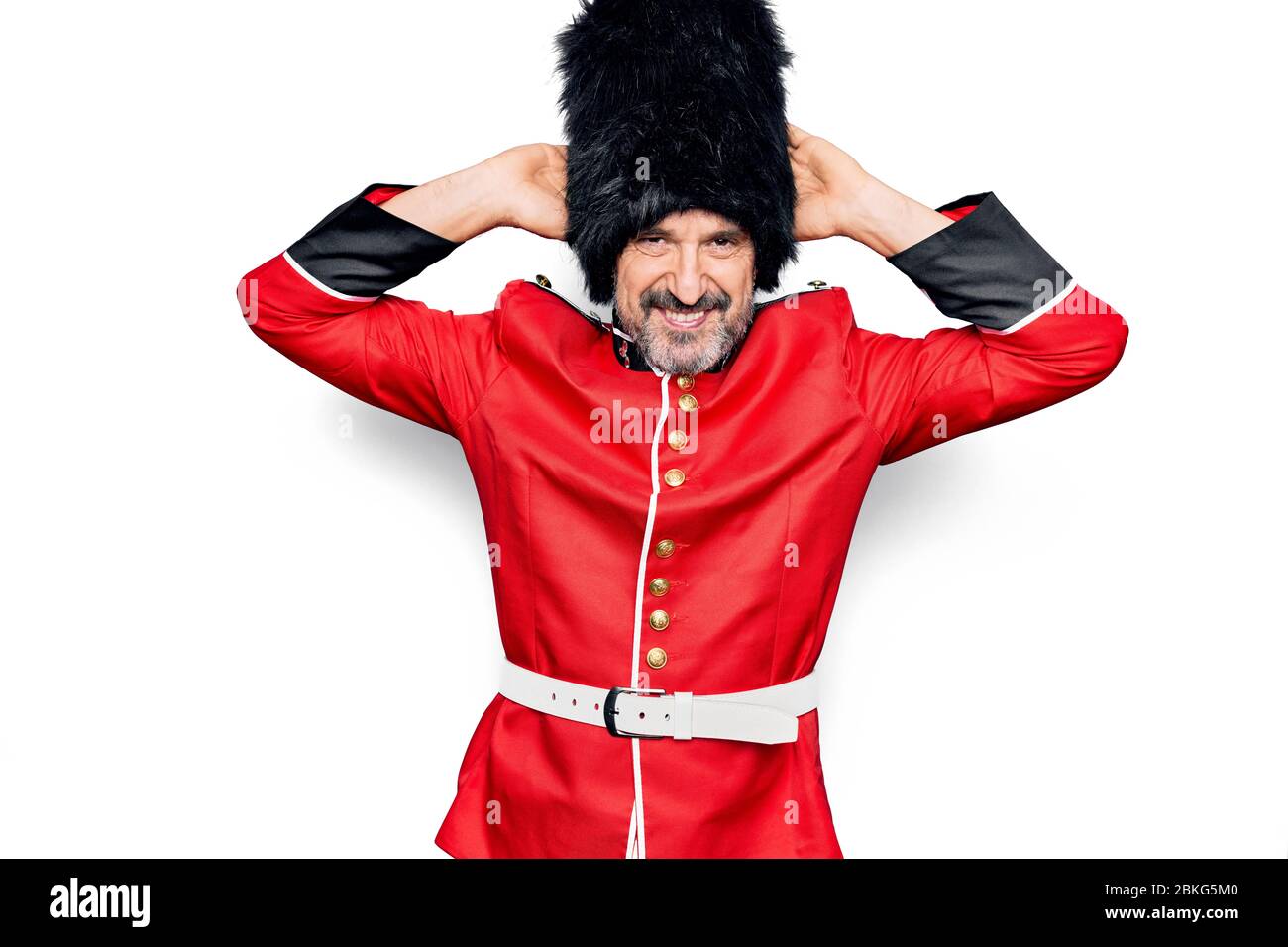 Middle age handsome wales guard man wearing traditional uniform over ...