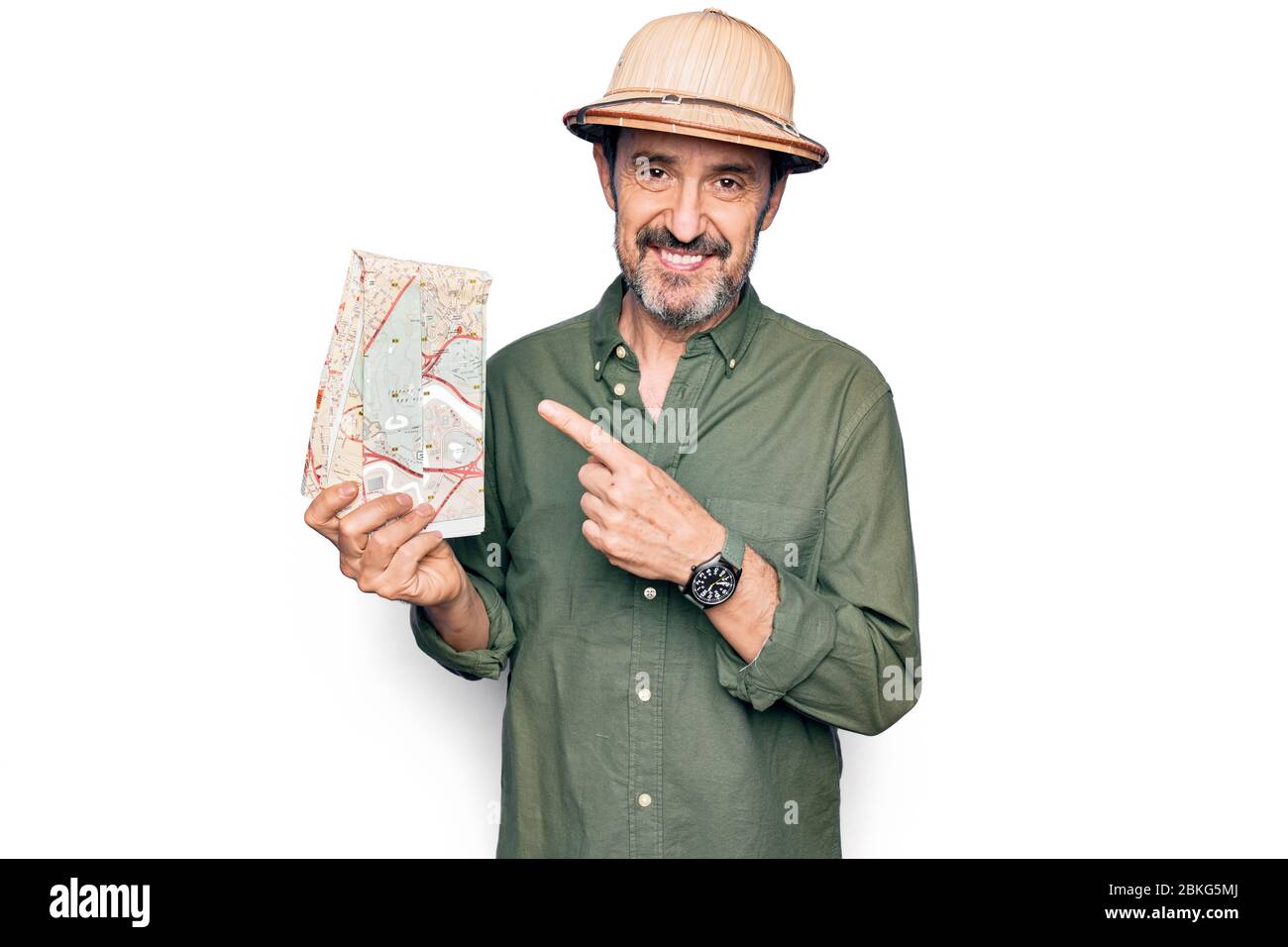 Middle age handsome tourist man on vacation wearing explorer hat ...