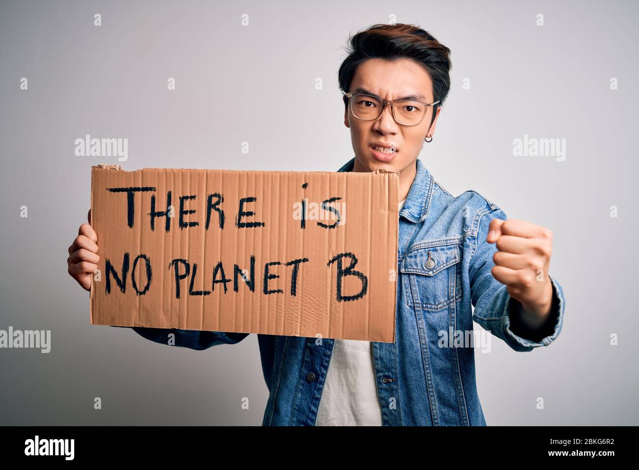 Young handsome chinese activist man protesting asking for care the ...