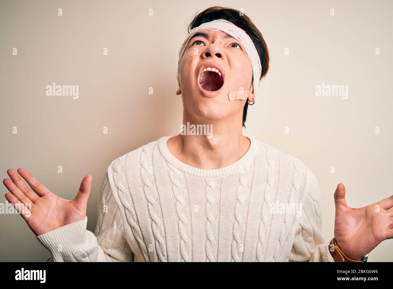 Young handsome chinese man injured for accident wearing bandage and ...