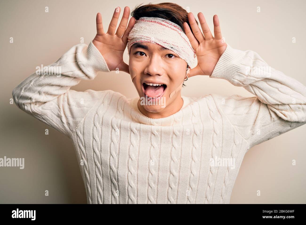 Young handsome chinese man injured for accident wearing bandage and ...