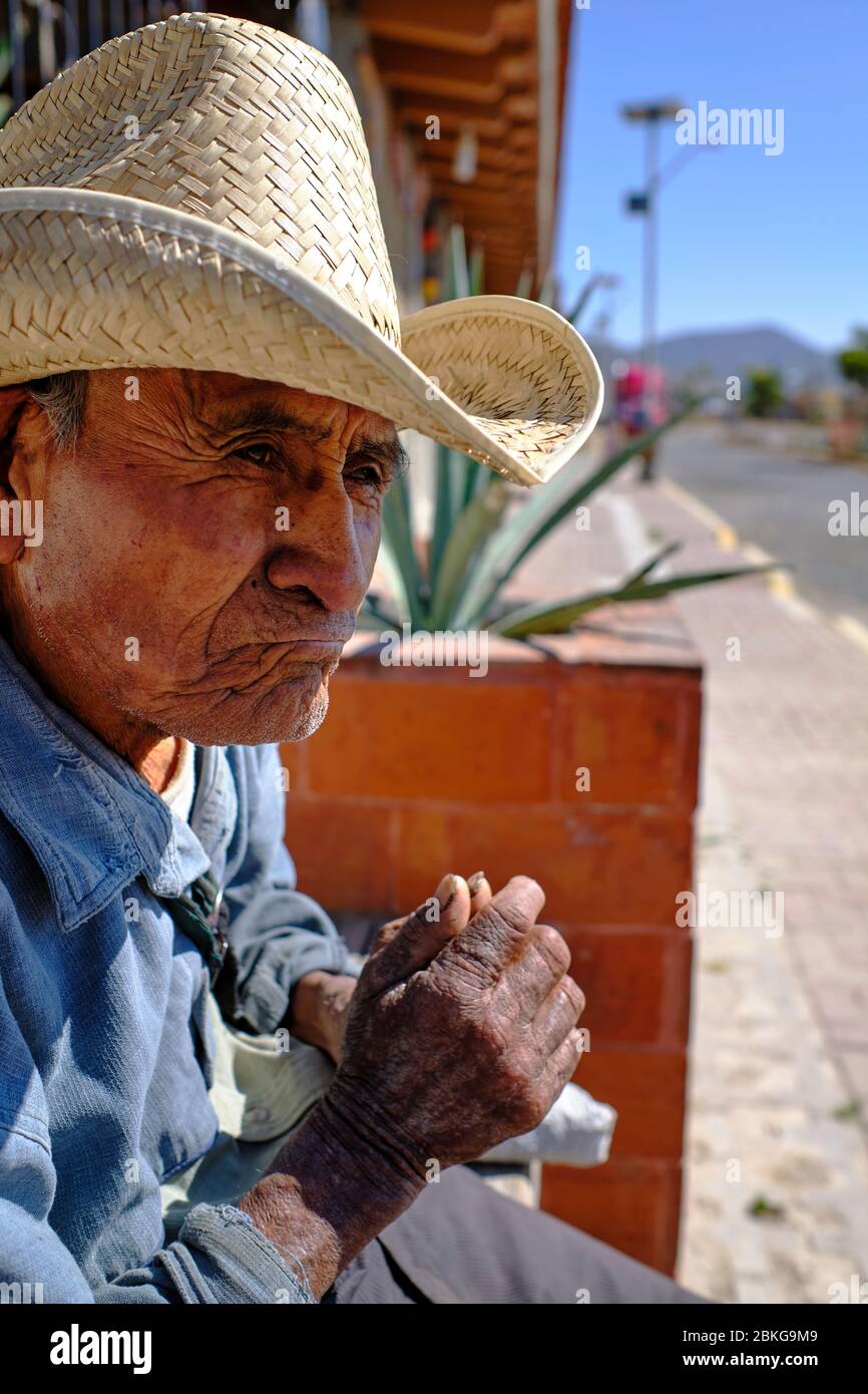 Portrait of an old peasant with a straw hat in the town of Santiago ...