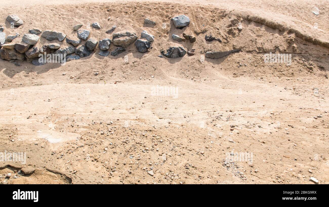 Sand and stones on the shore of sea in Spain. Nature texture and grit ...