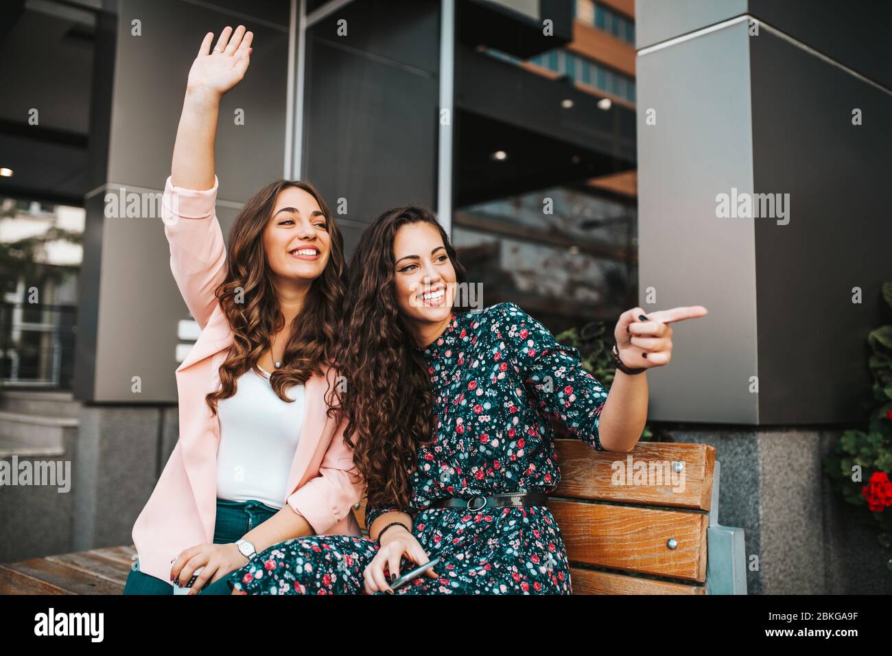 Woman waving goodbye on street hi-res stock photography and images - Alamy
